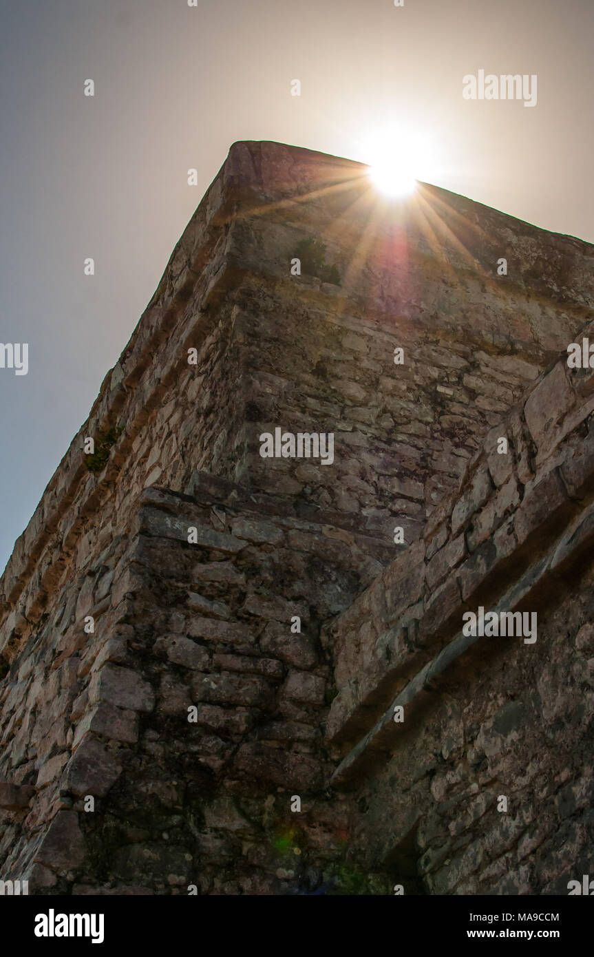 Sun rising over a Mayan pyramid ruin in stones in Tulum Mexico Stock ...