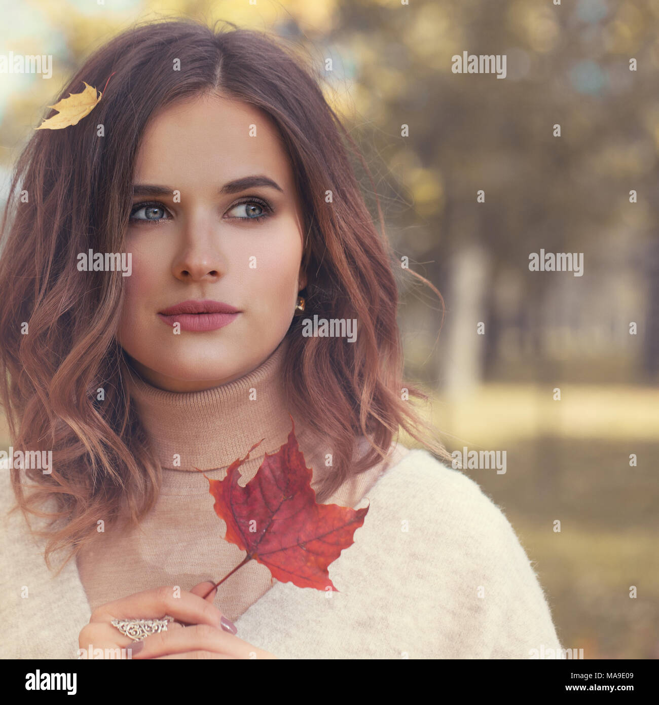 Beautiful Young Woman Fashion Model with Red Fall Mapple Leaf Outdoors ...