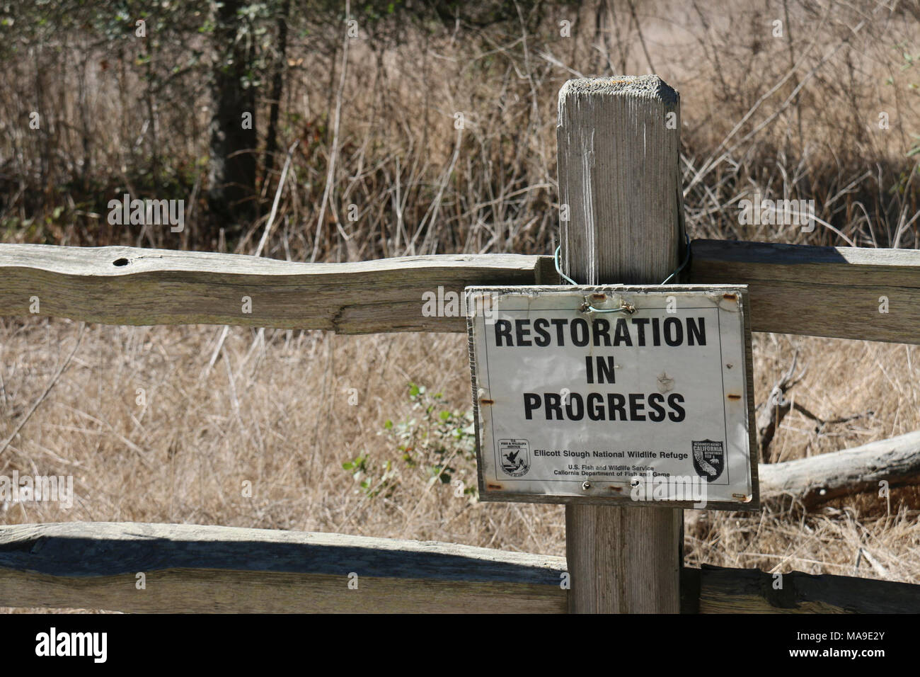 Restoration in Progress. Sign designating habitat restoration work on ...