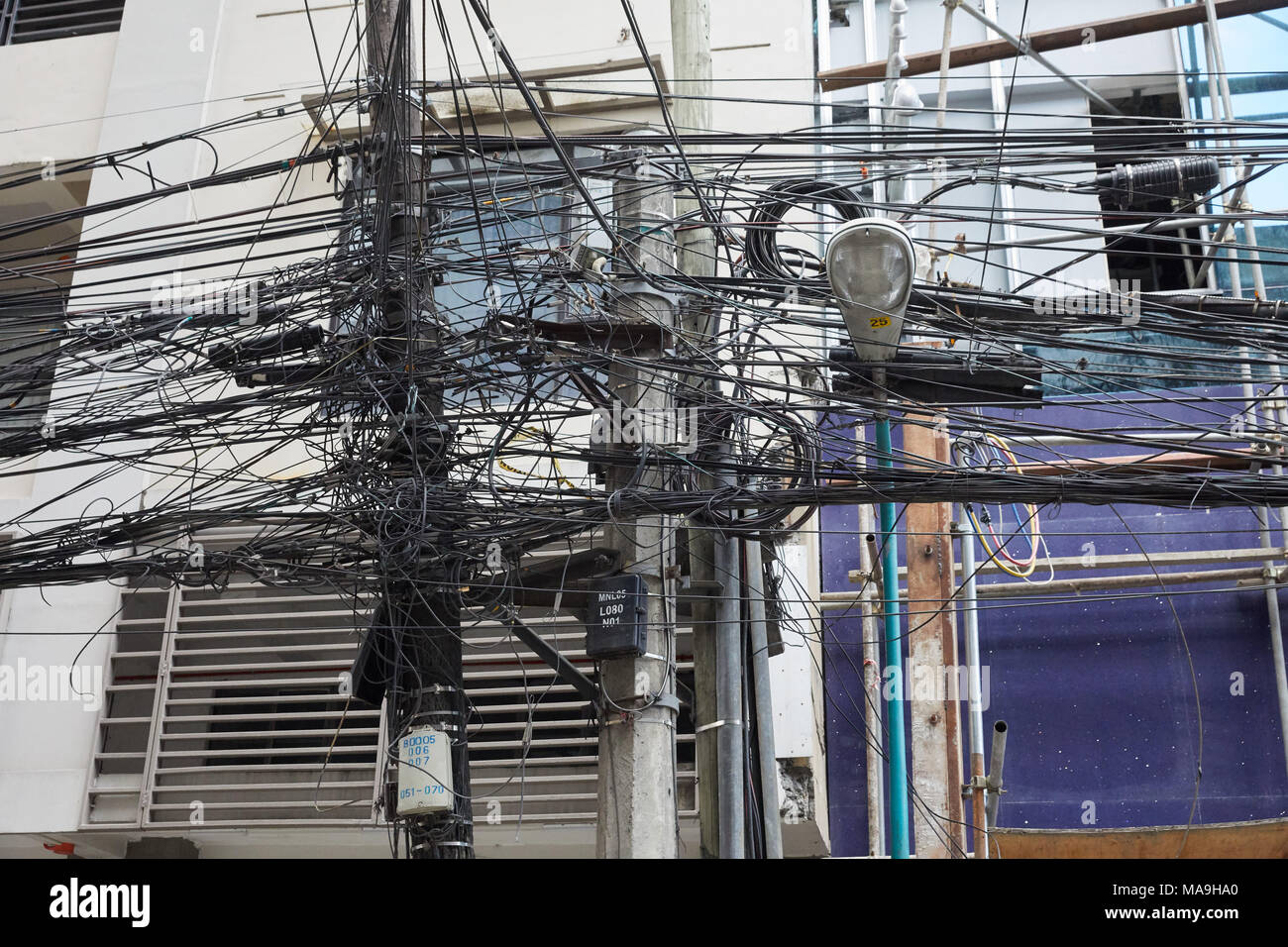 18 March 2018, Philippines, Manila: Posts with power cables in the ...