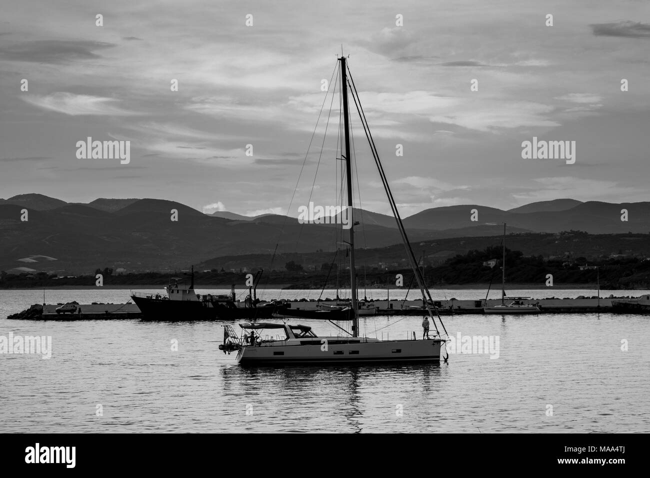 A boat entering a port Stock Photo - Alamy
