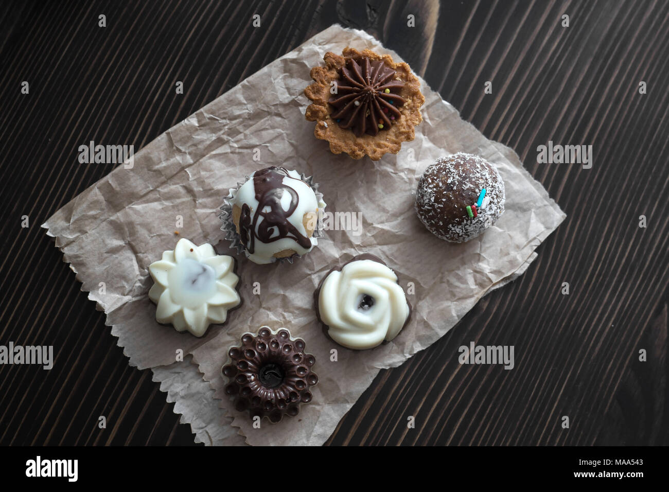 Different kinds of beautiful pastry, small colorful sweet cakes, from ...
