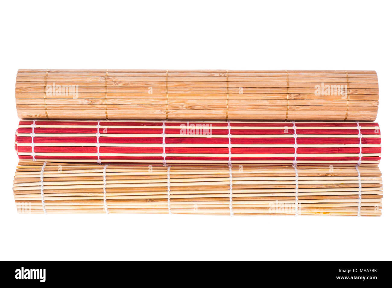 Bamboo mats of different colors on white background. Studio Photo Stock ...