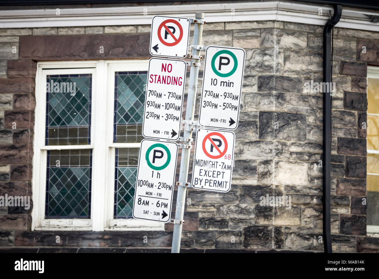 Typical North American no parking signs with detailed instructions on ...