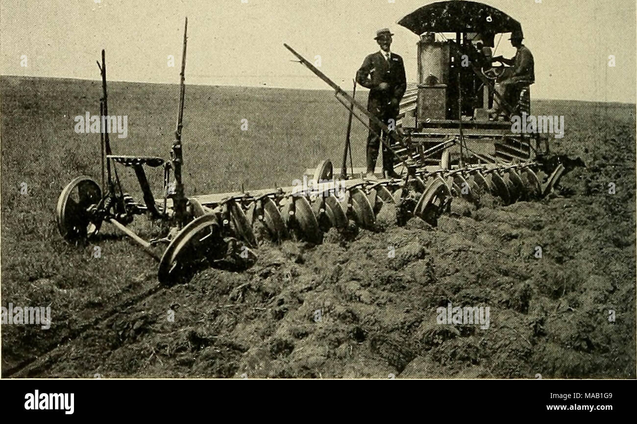 . Dry-farming: . A GASOLENE-TRACTION PLOWING OUTFIT AT WORK ON A MOO ...