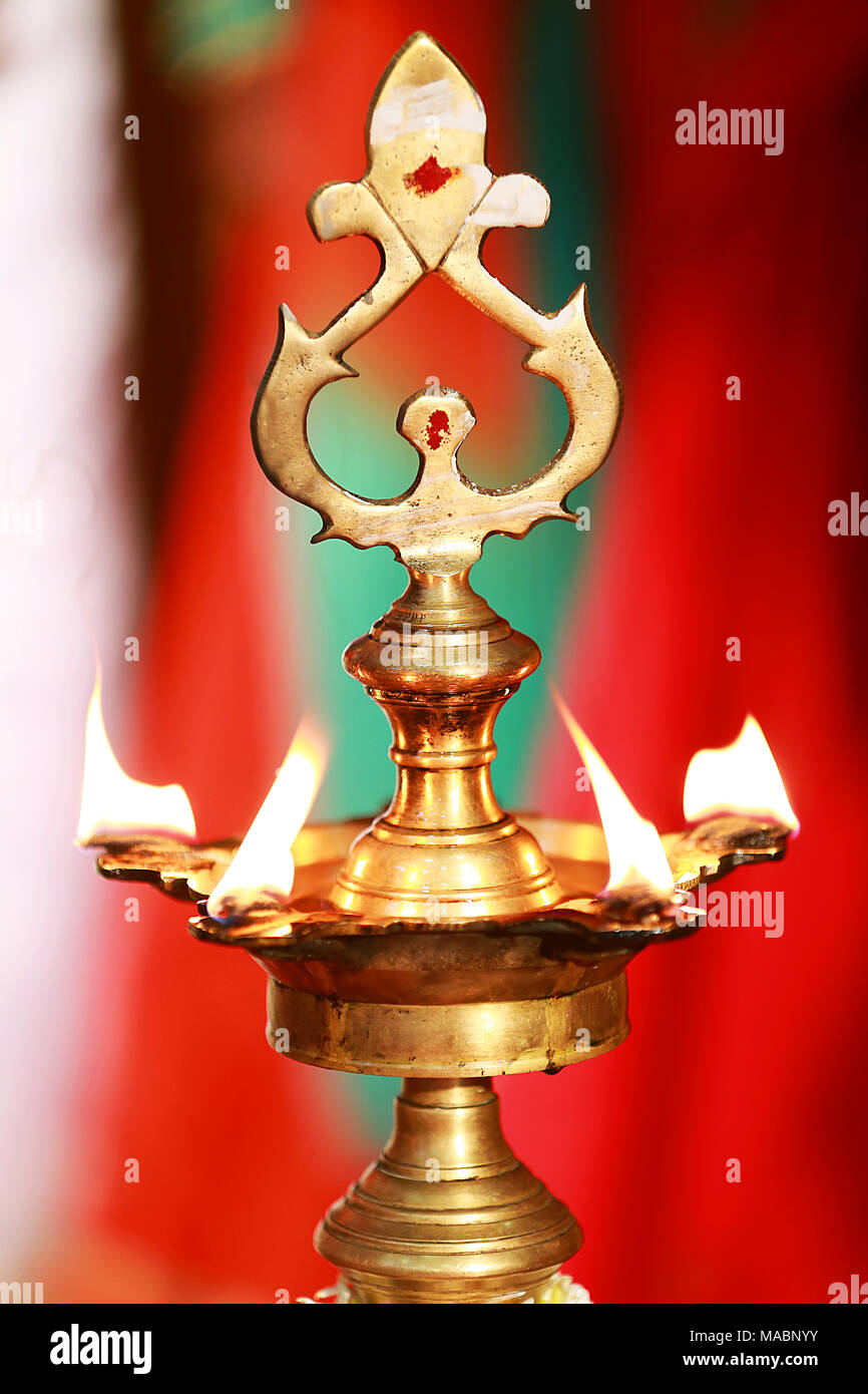 Oil lamps on Indian wedding ceremony on red carpet Stock Photo - Alamy