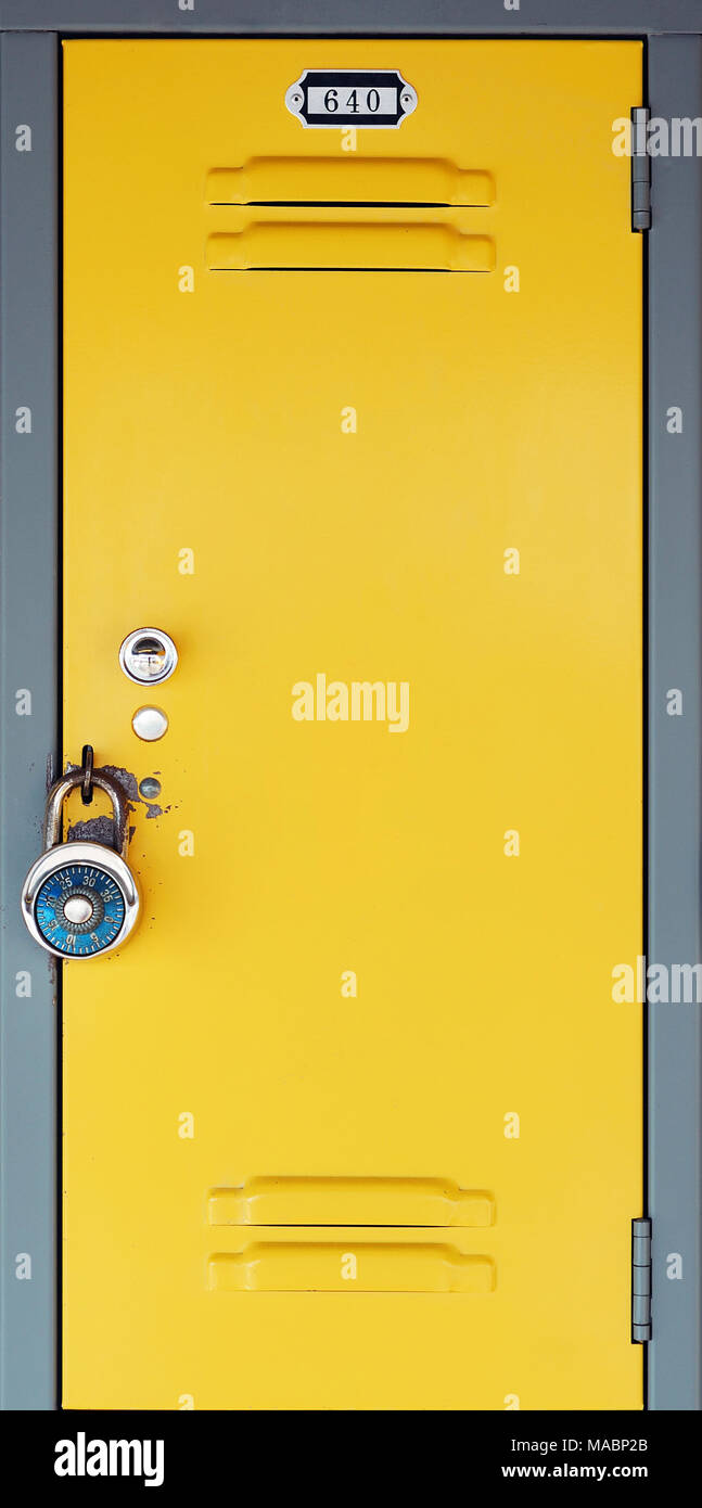 Yellow School Locker with Blue Combination Lock - The door of a single ...