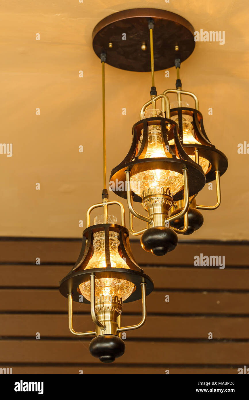 Yellow lamps with glass structure on ceiling in ballroom hi-res stock ...