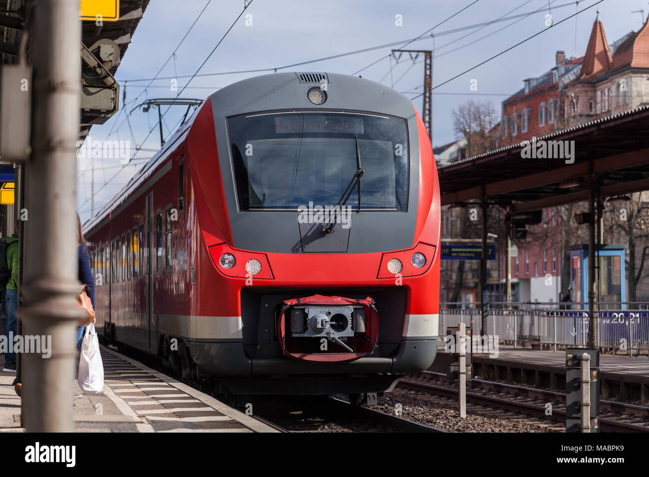 a german train passes a train station Stock Photo - Alamy