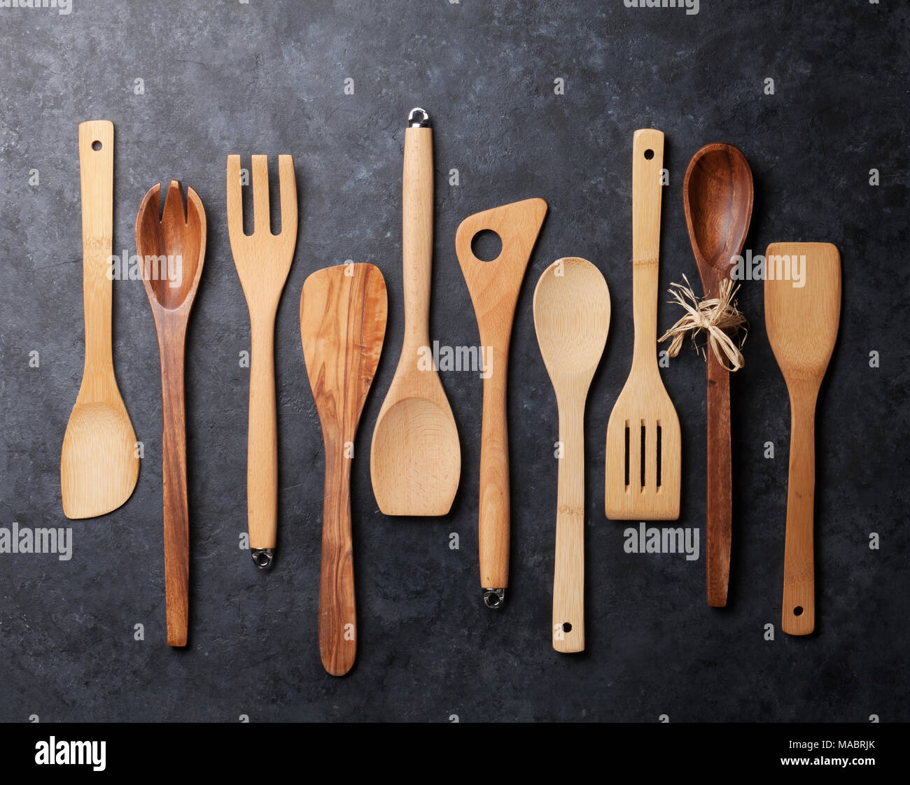 Various cooking utensils over stone kitchen table. Top view Stock Photo ...