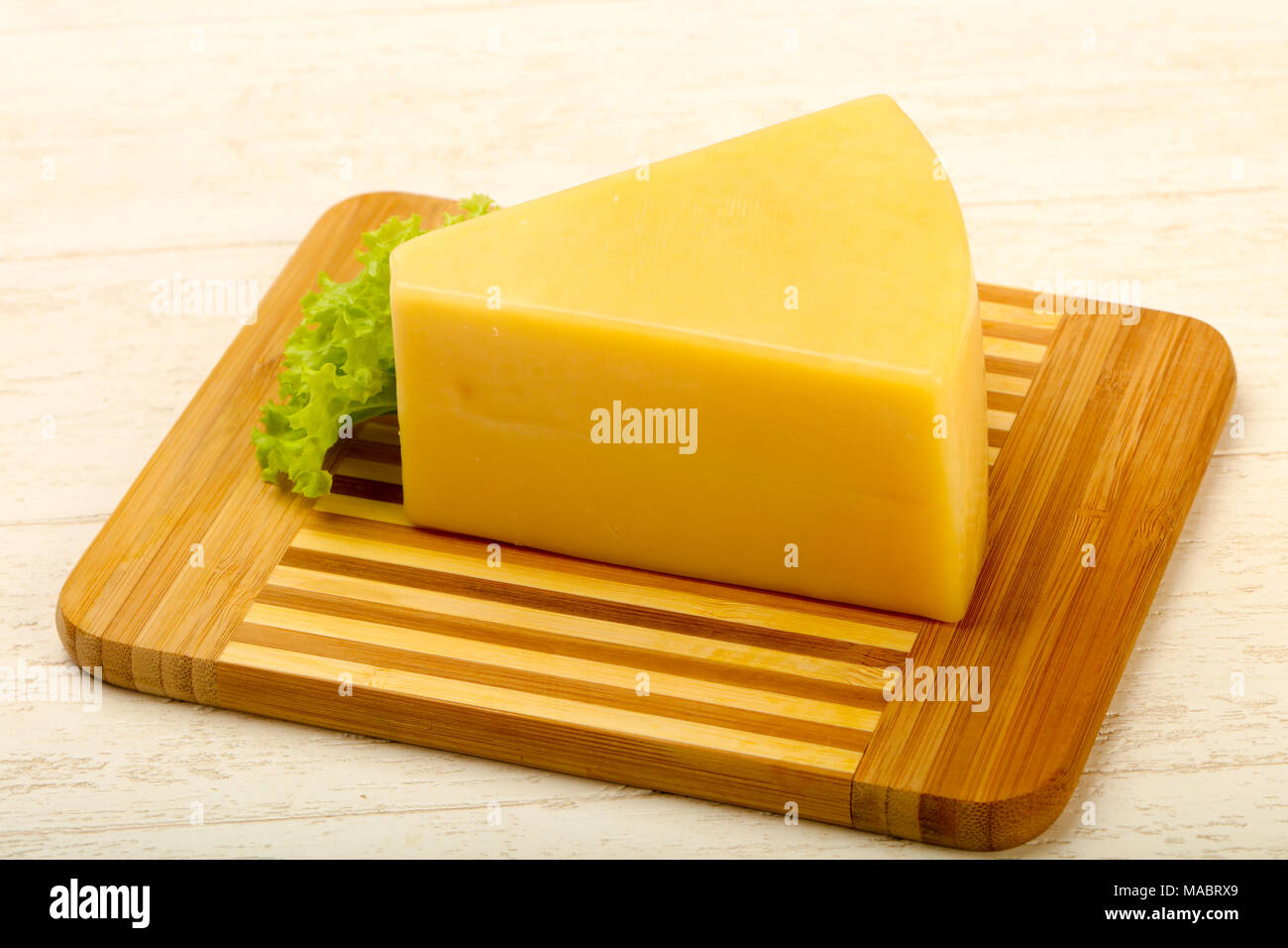 Parmesan cheese triangle Stock Photo - Alamy