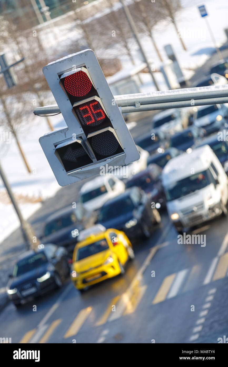 Cars stand at an intersection until the traffic light shows red Stock ...