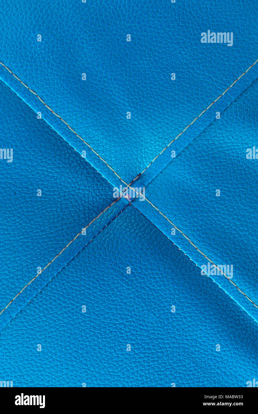 Blue leather with stitch texture and crosswise symbol Stock Photo - Alamy
