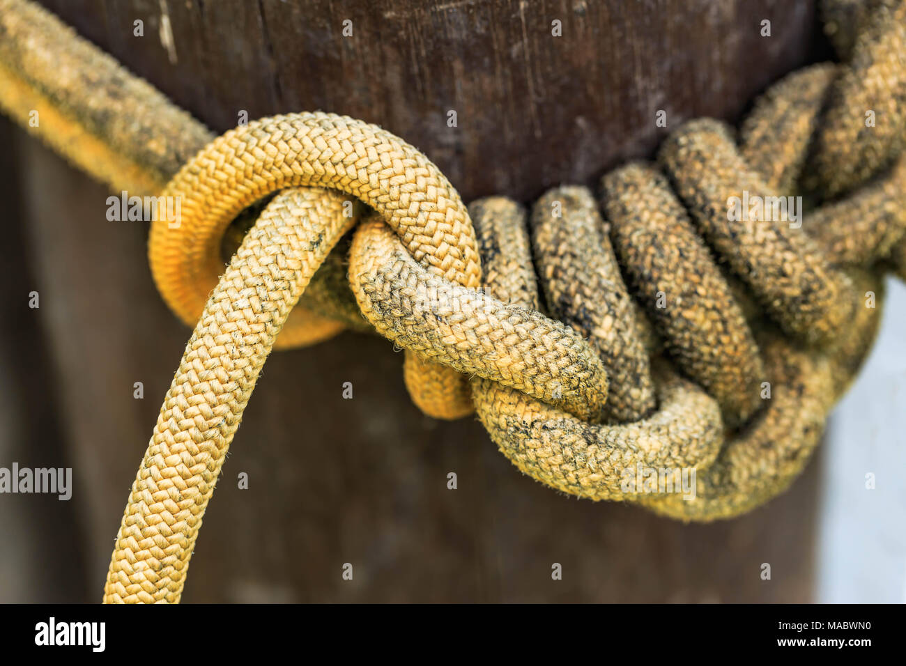 rope tied wood pole close up Stock Photo - Alamy
