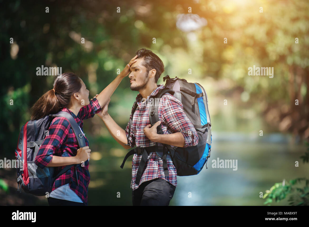 Hiking couple in forest together. Adventure travel vacation. Happy time hiking Stock Photo - Alamy