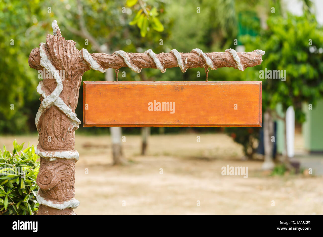 Beautiful hanging wooden sign Stock Photo - Alamy