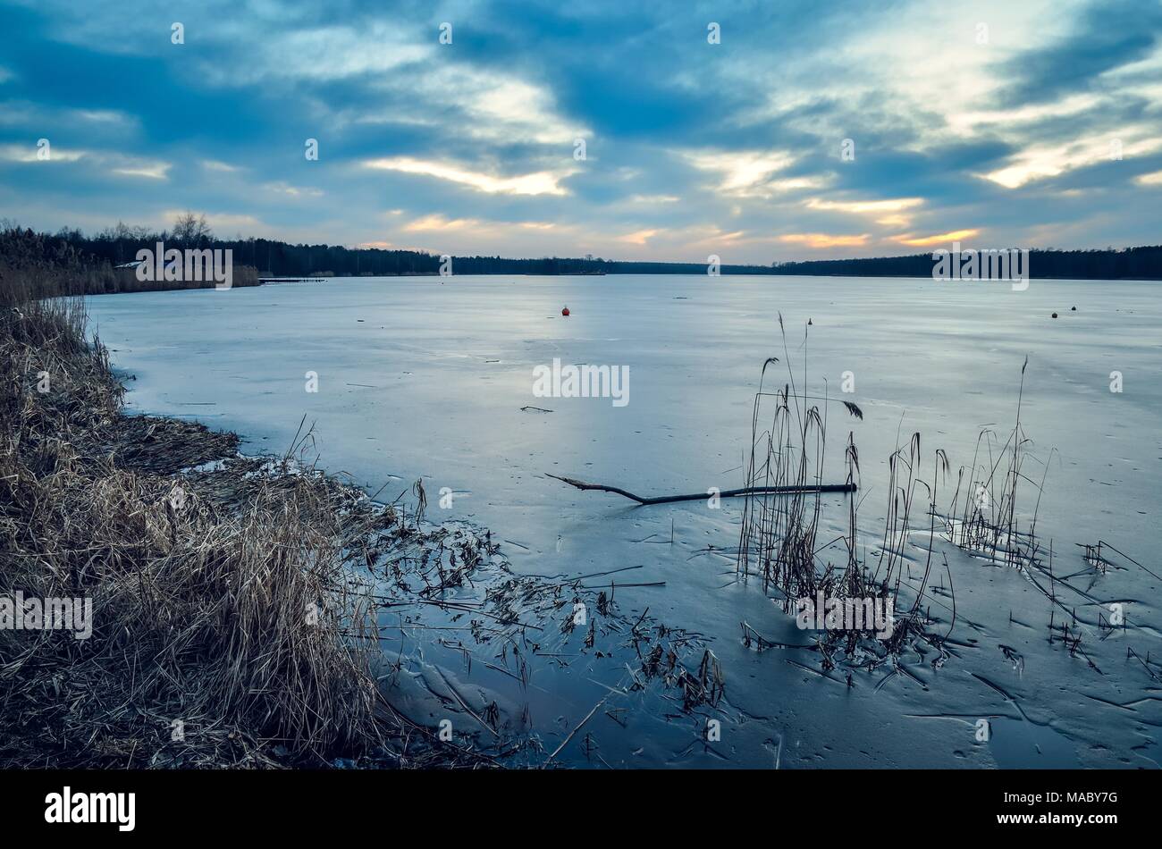 Evening winter landscape. View after sunset over a beautiful lake Stock ...