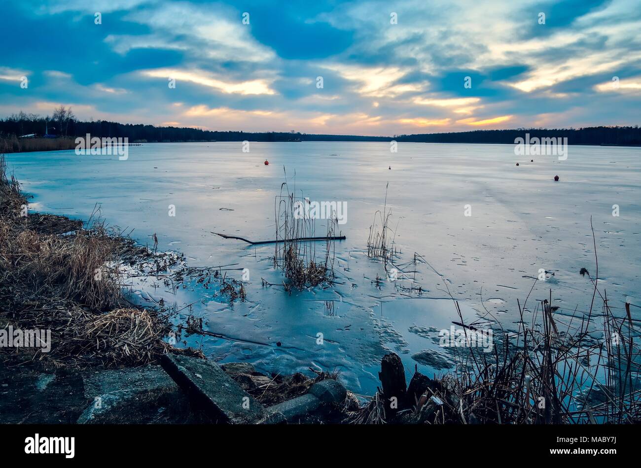Evening winter landscape. View after sunset over a beautiful lake Stock ...