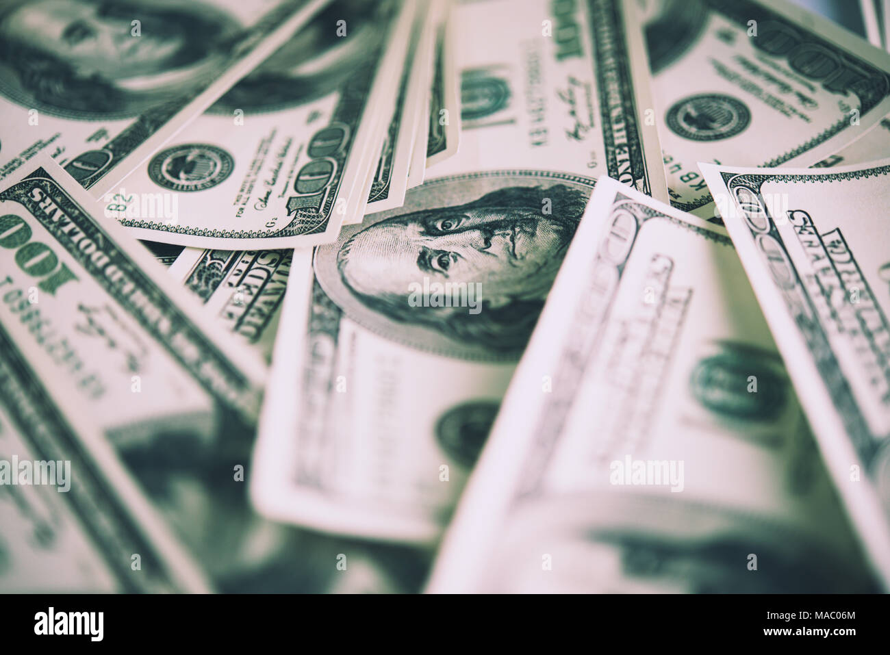 Working place of trader. The table covered by cash notes, keyboard and ...