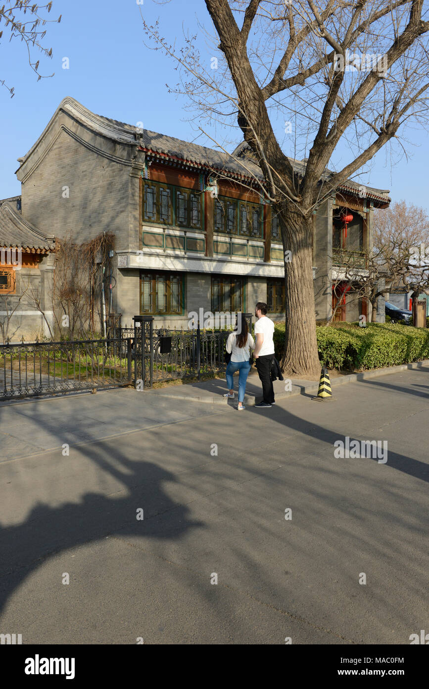 A couple admire a restored building at Houhai in north central Beijing ...
