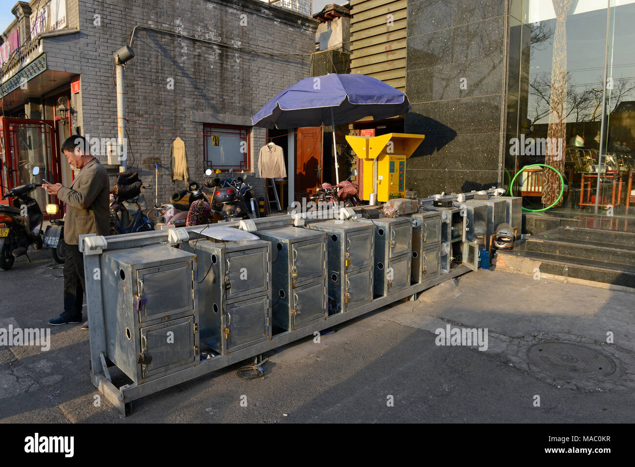 Lockers on a pavement outside a restaurant in central northern Beijing ...
