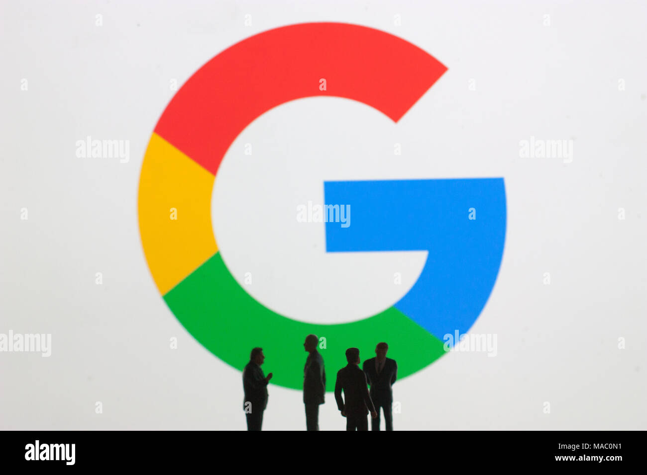 Google logo with models of people in foreground Stock Photo - Alamy
