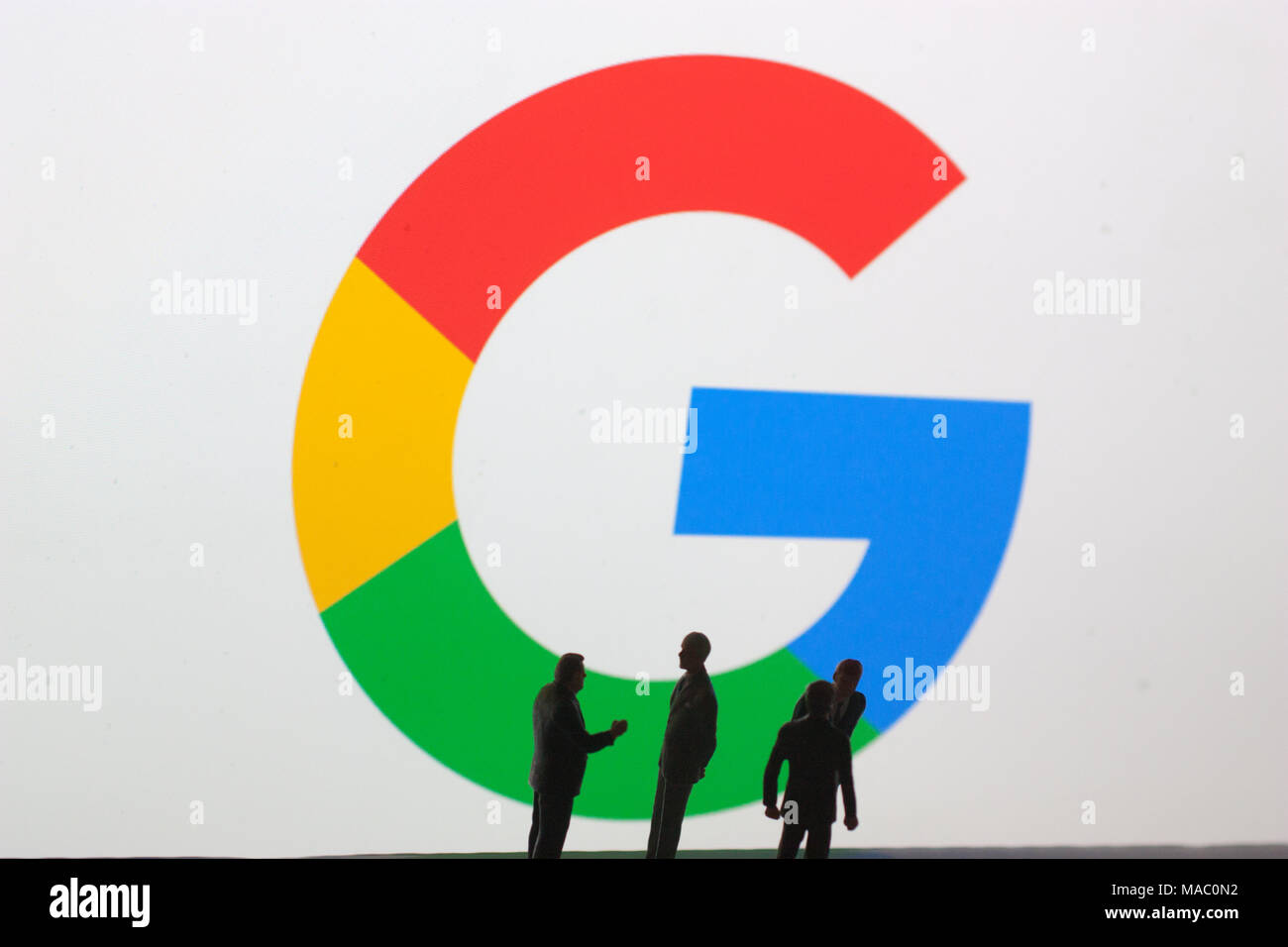 Google logo with models of people in foreground Stock Photo - Alamy