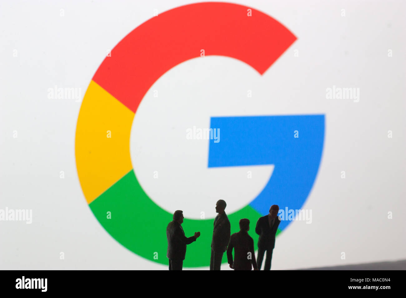 Google logo with models of people in foreground Stock Photo - Alamy