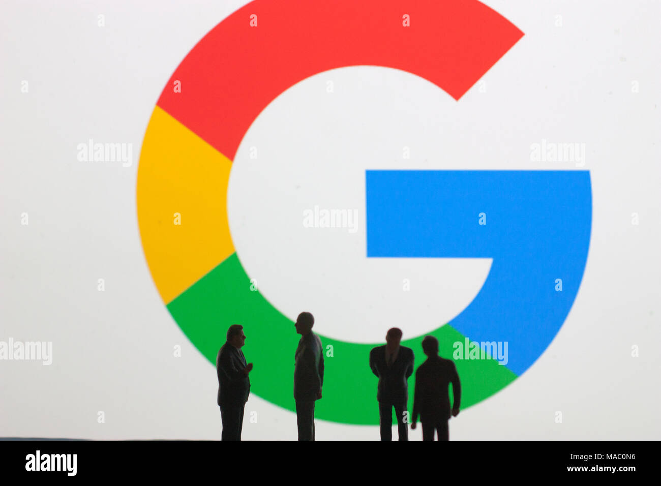 Google logo with models of people in foreground Stock Photo - Alamy
