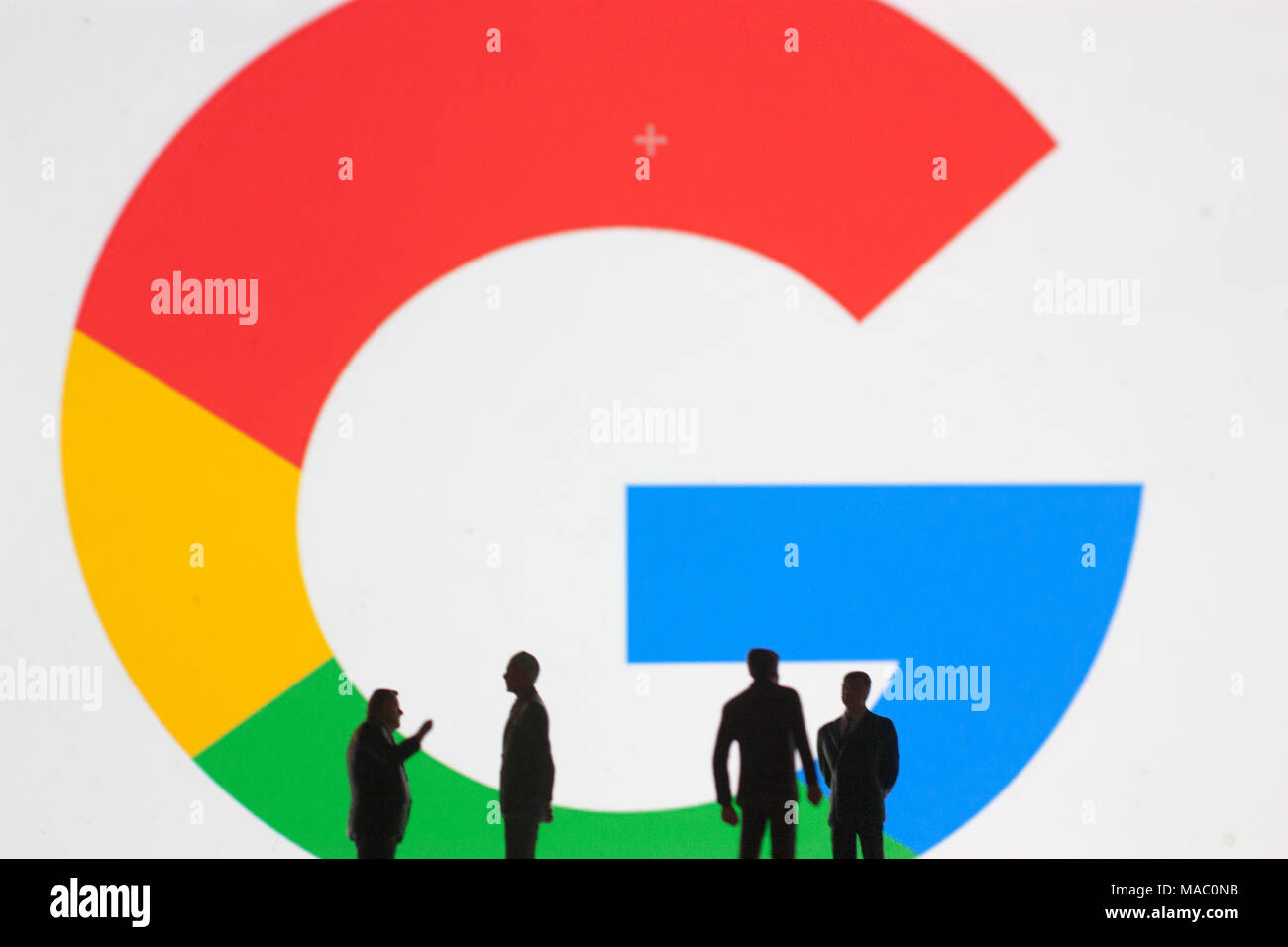 Google logo with models of people in foreground Stock Photo - Alamy