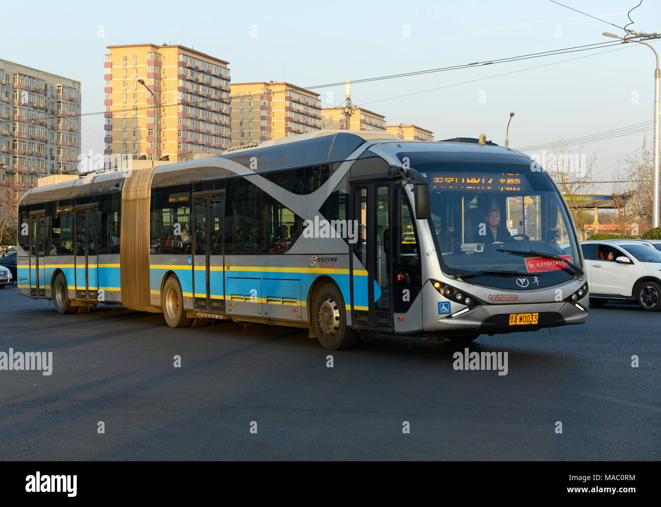 One of the few bendy buses in Beijing, China, approaches Andingmen ...