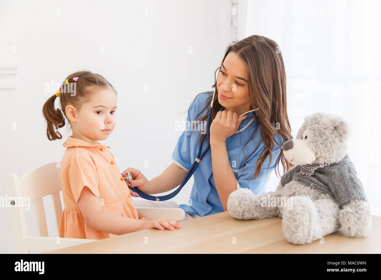 Little girl at a pediatrician's appointment Stock Photo - Alamy