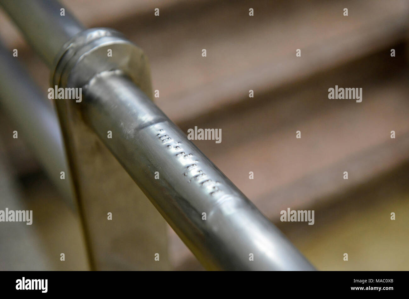 Braille notice on a handrail in the Beijing subway Stock Photo - Alamy