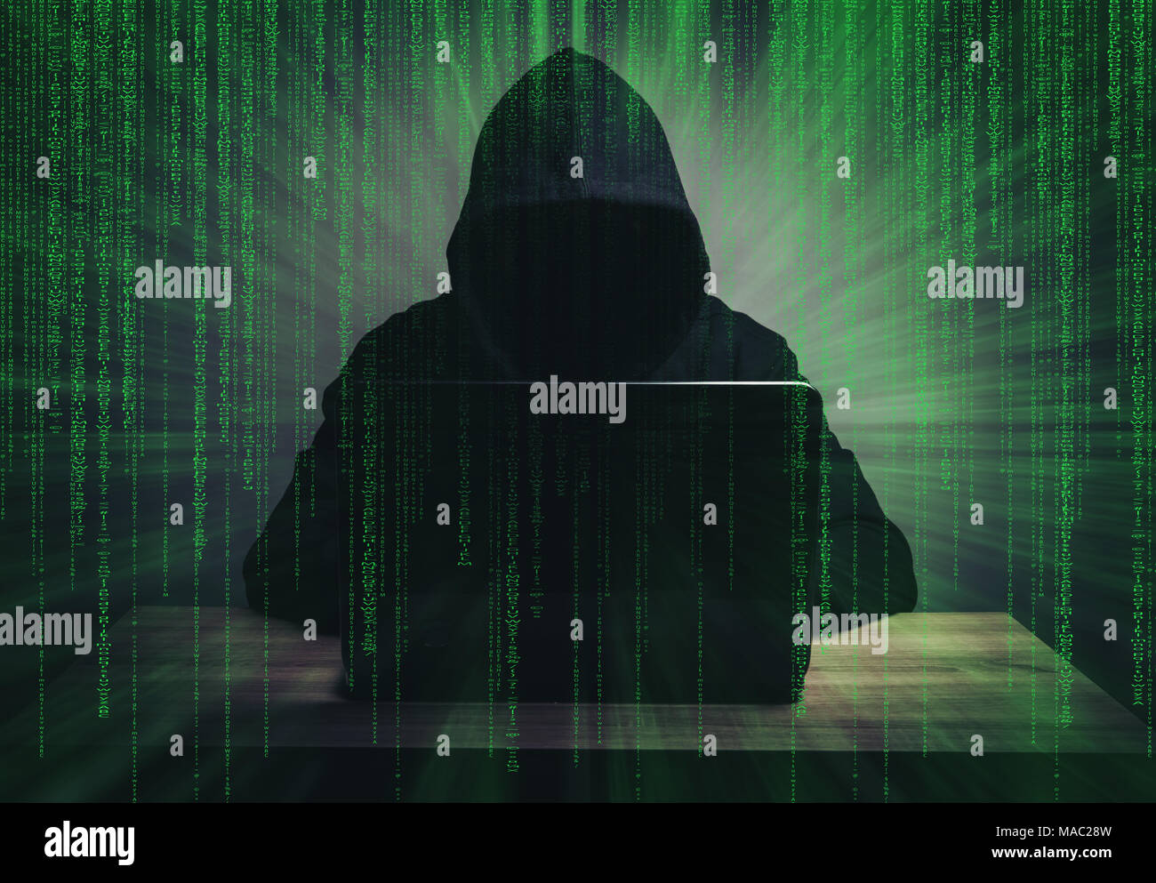 programmer hacker working on front of his laptop writing code in the ...