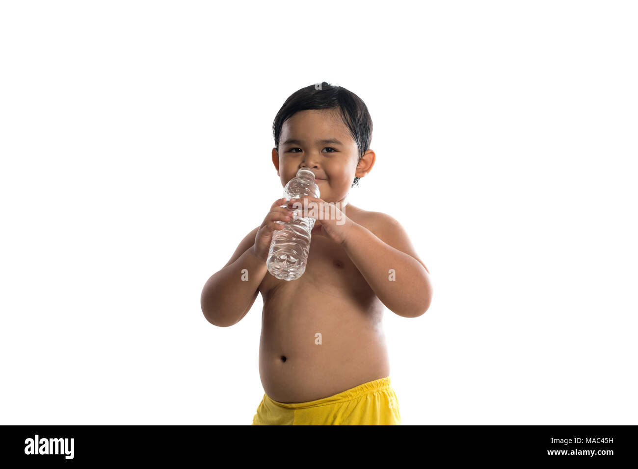 Happy boy drinks water from a bottle isolated on white background Stock ...