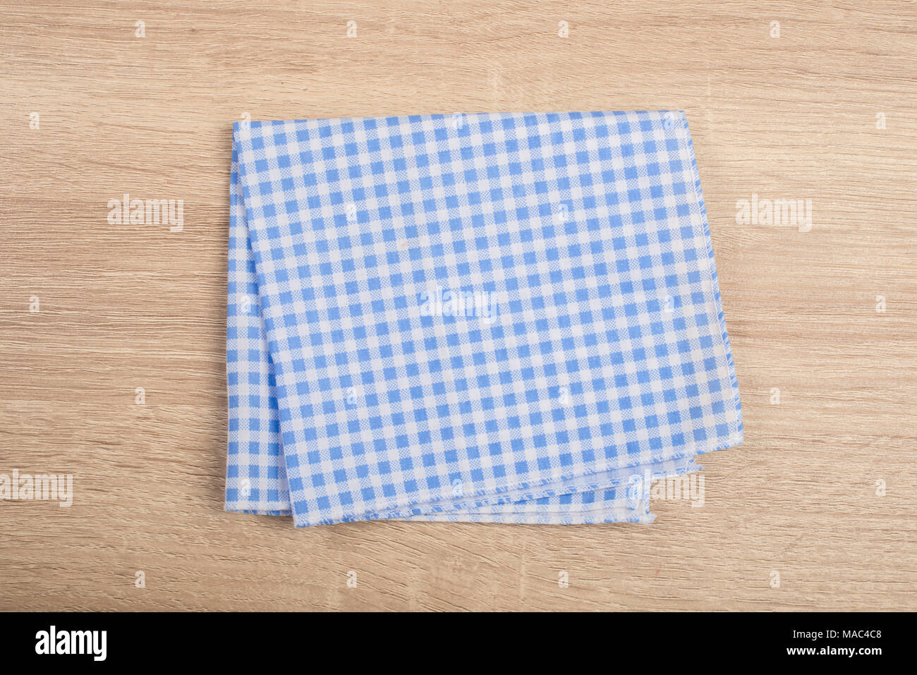 Blue table napkins isolated on white background Stock Photo - Alamy