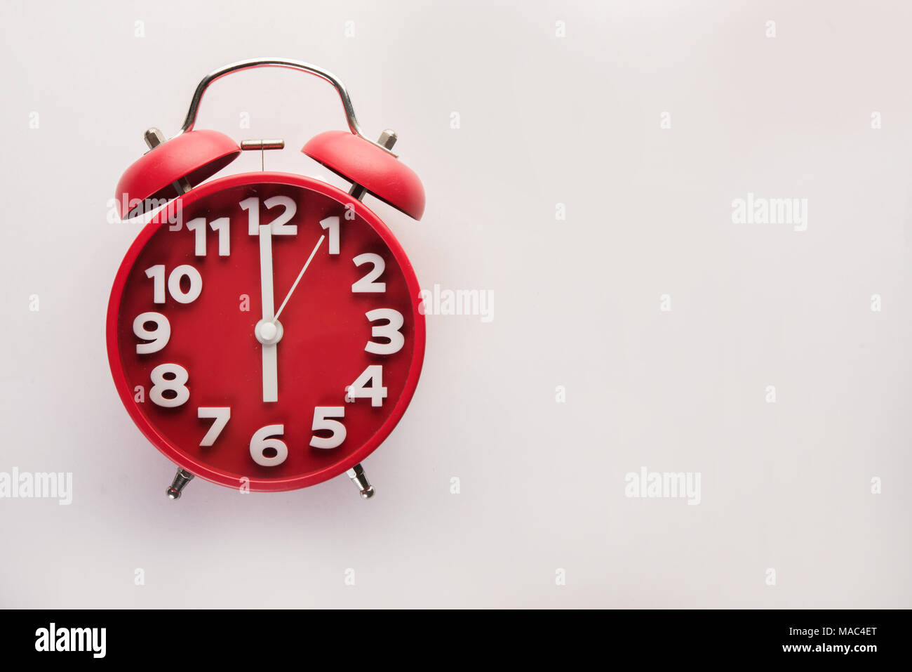 Red alarm clock isolated on white background. Business time concept ...