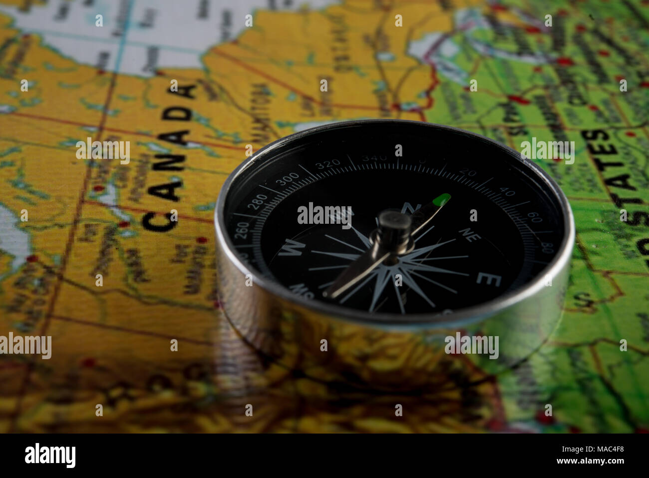 Compass with map background. Travel concept Stock Photo - Alamy