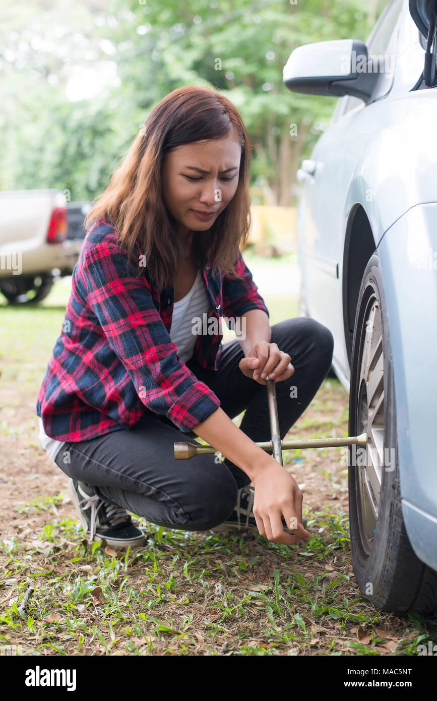 Young woman flat tire on hi-res stock photography and images - Alamy