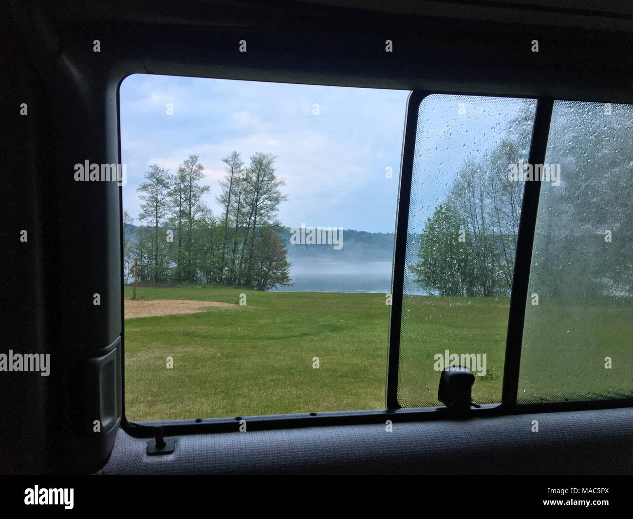 Chilling in the camper van during rain at the lake side Stock Photo - Alamy