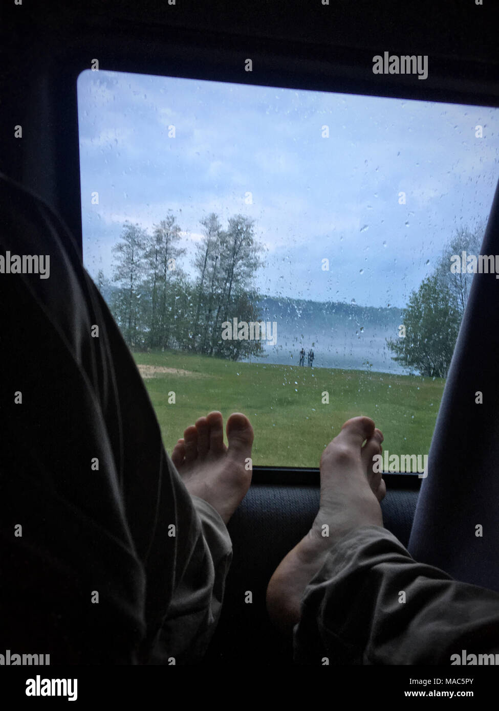 Chilling in the camper van during rain at the lake side Stock Photo - Alamy
