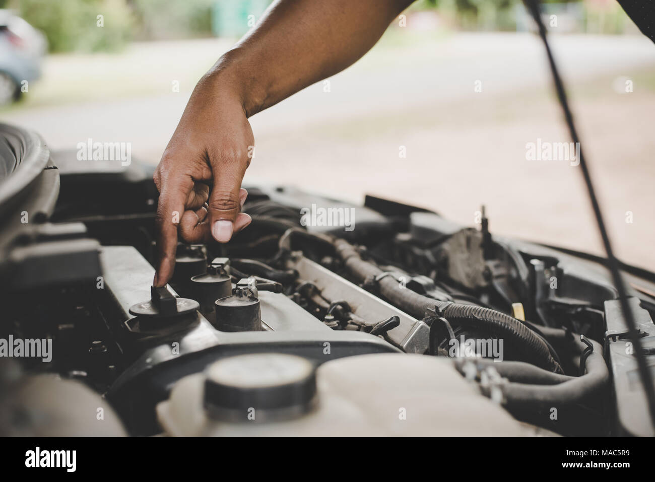 Man with checking car engine Stock Photo - Alamy