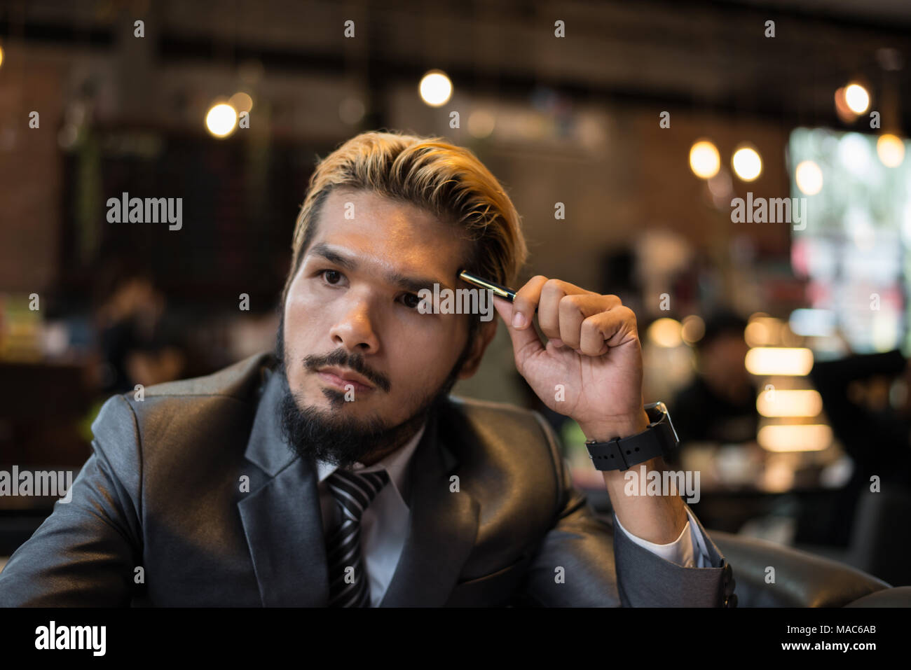Handsome businessman thinking working hi-res stock photography and ...