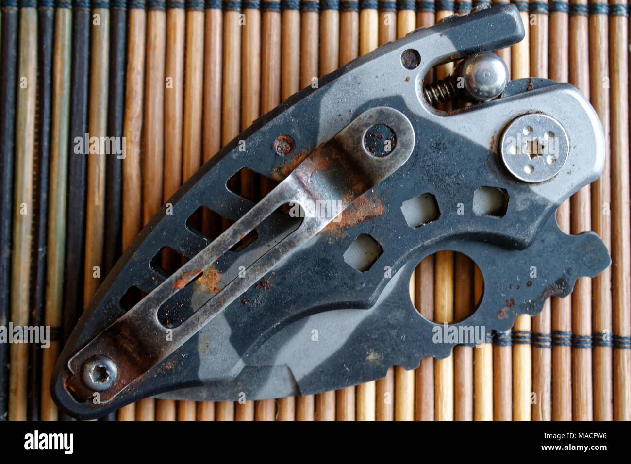 Small jackknife on a wooden background, top view Stock Photo - Alamy