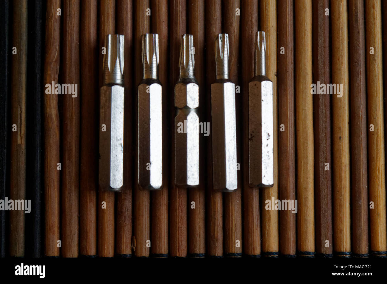 Head for screwdriver (bits) on wooden background, Tools collection turn ...