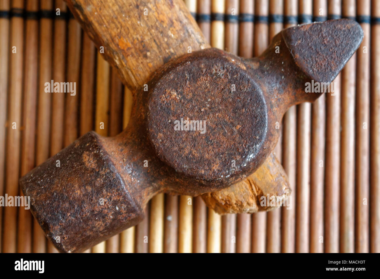 Vintage small hammer head on wooden table background Stock Photo - Alamy