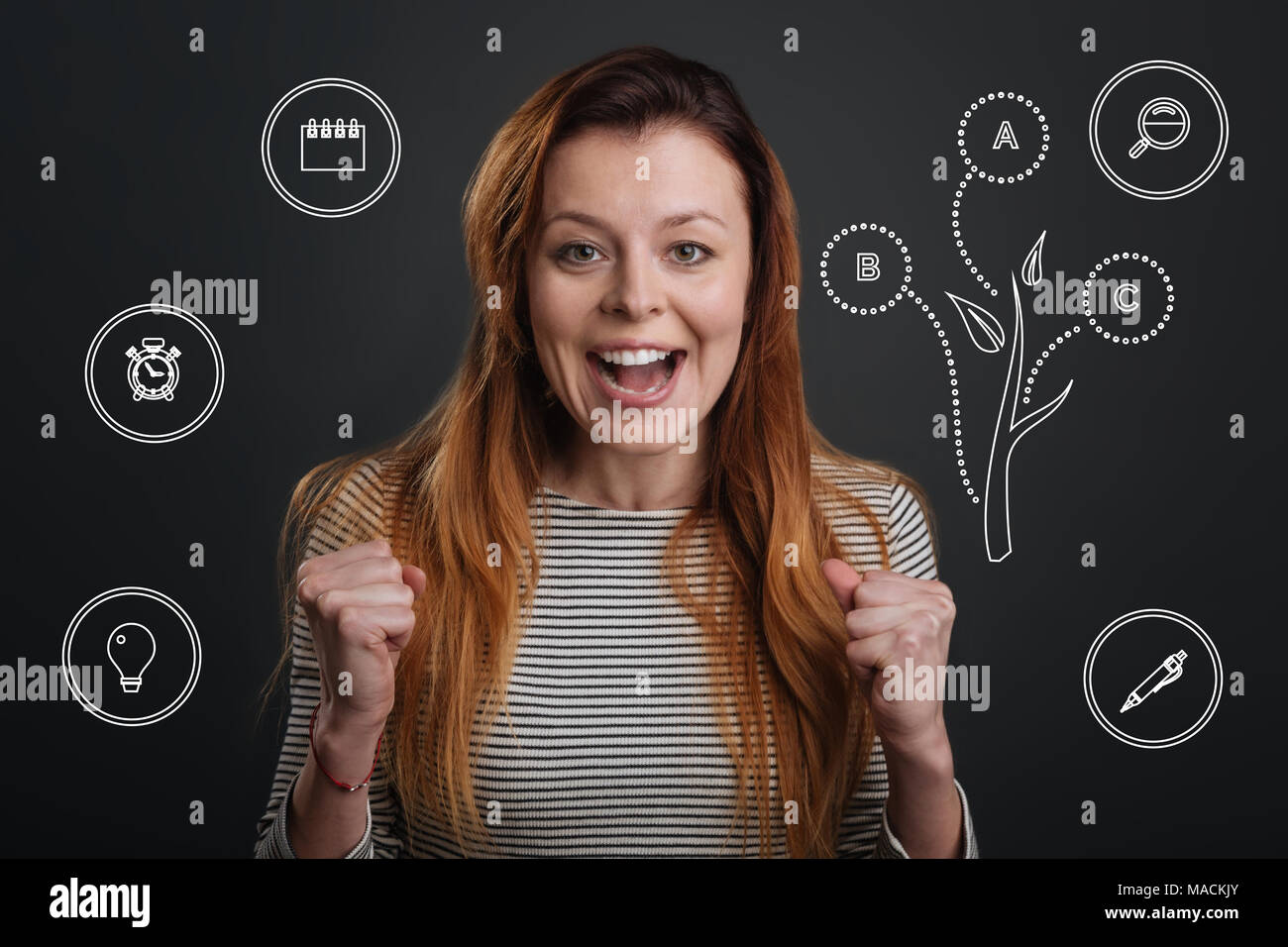 Emotional woman feeling excited while working at her new project Stock ...