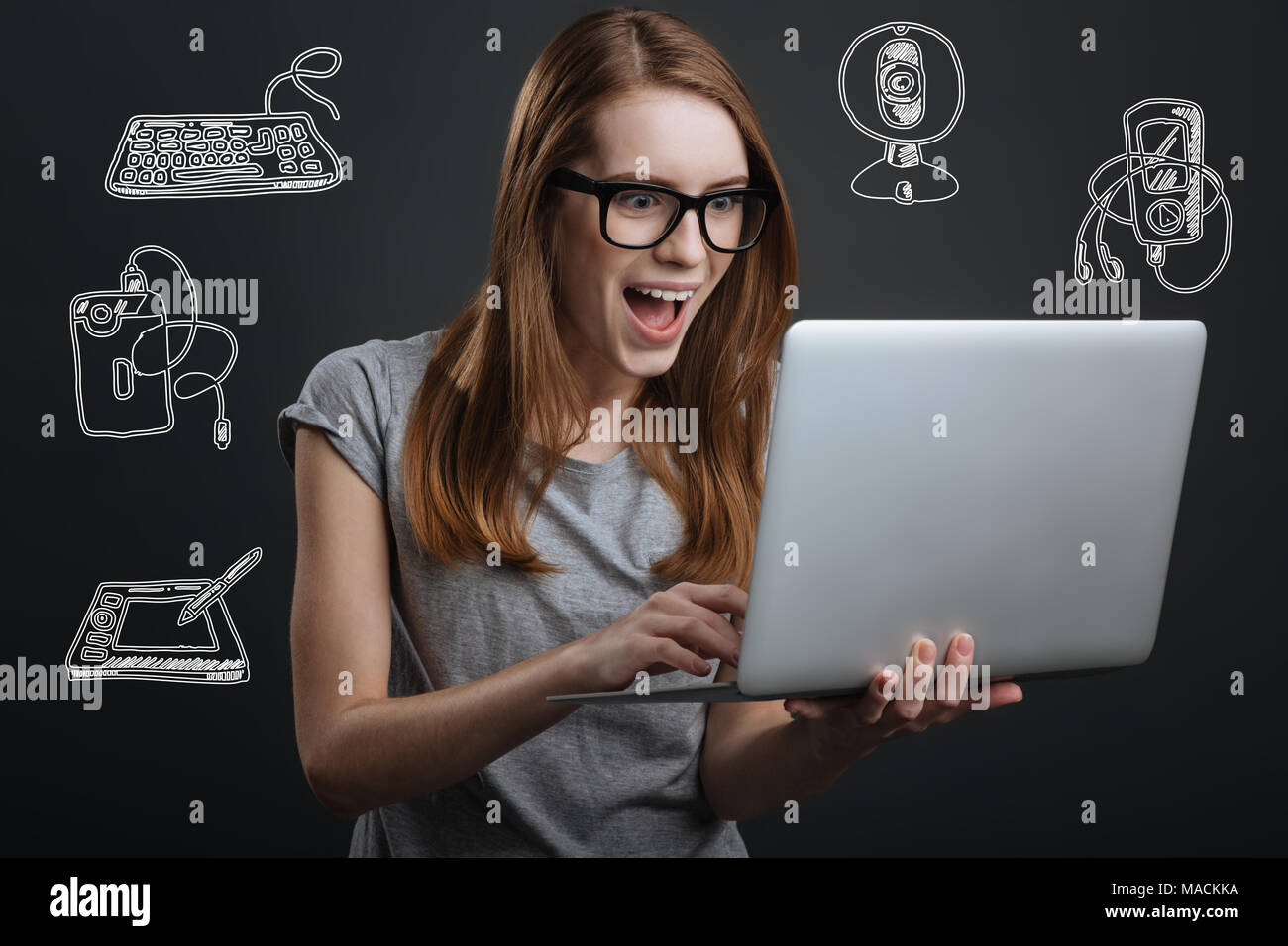 Excited woman opening her mouth while looking at the sale in the ...
