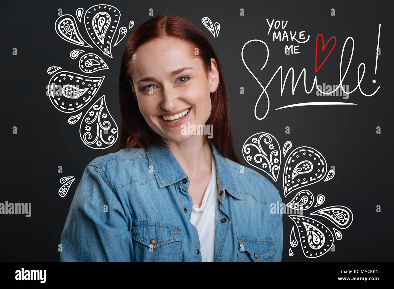 Relaxed woman looking happy and smiling while being alone Stock Photo ...