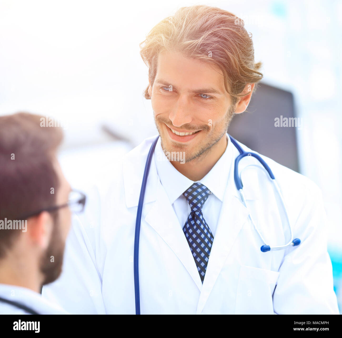 Group of doctors talking Stock Photo - Alamy